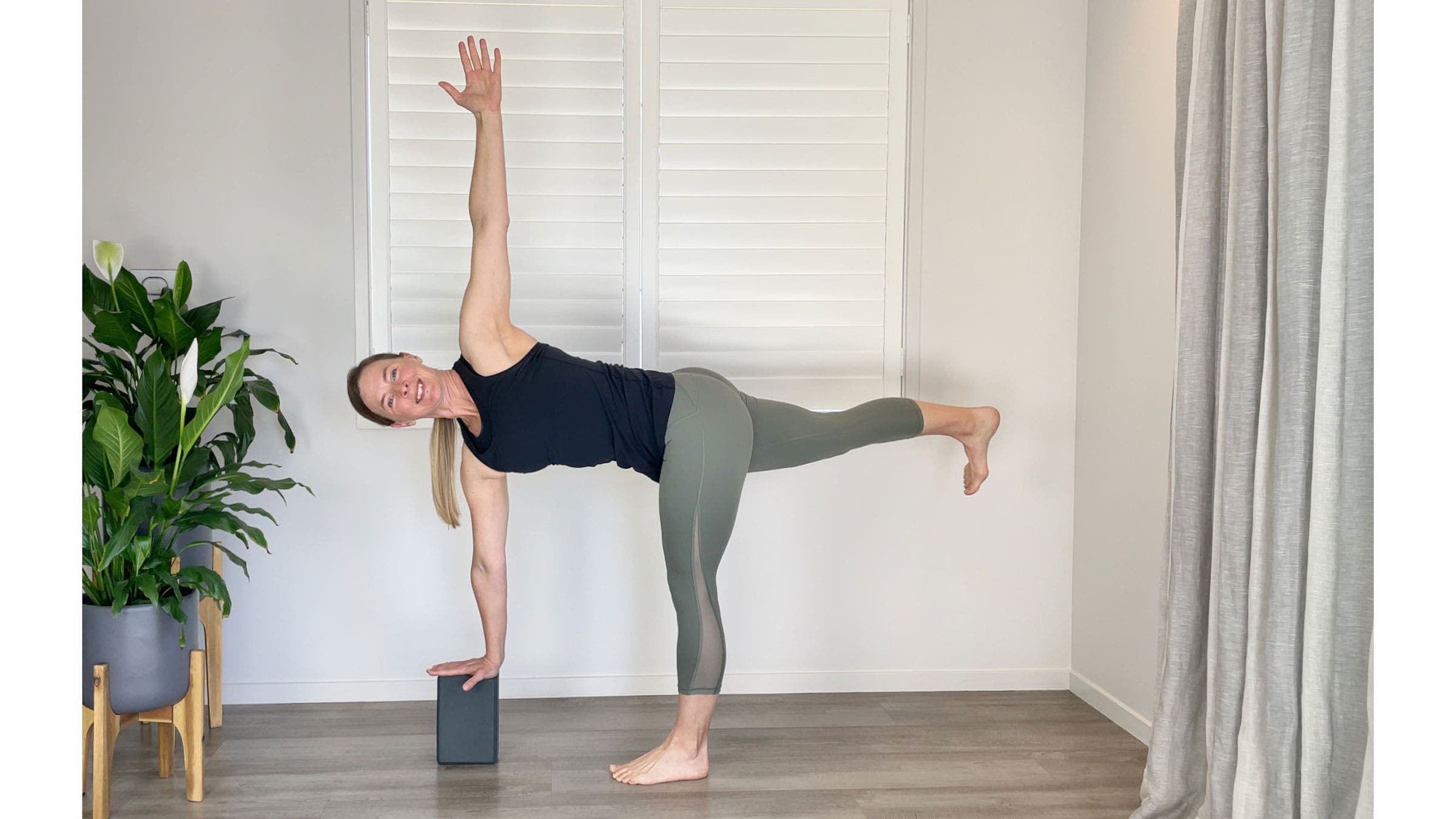 How a Wall Can Help You Practice Revolved Half Moon Pose