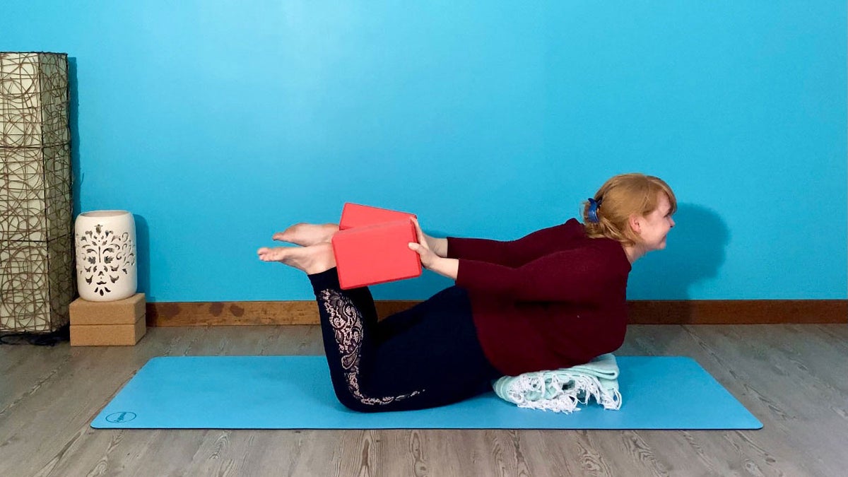 Build a Stronger Bow Pose With This Prop-Supported Sequence