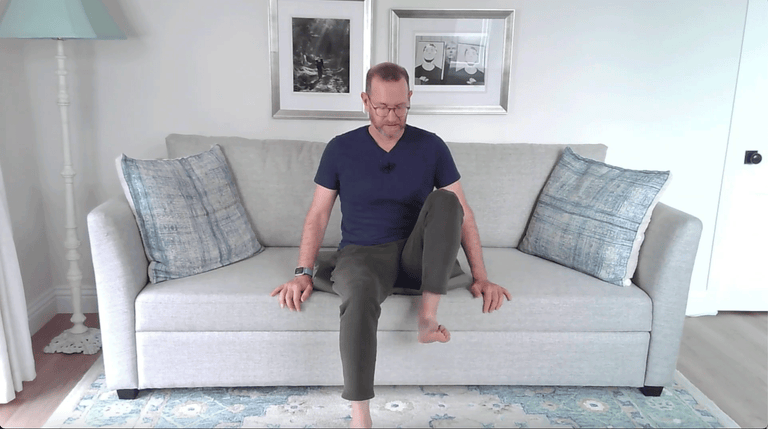 A Quick Couch Yoga Practice (Yes, Couch) So You Can Stay Sitting